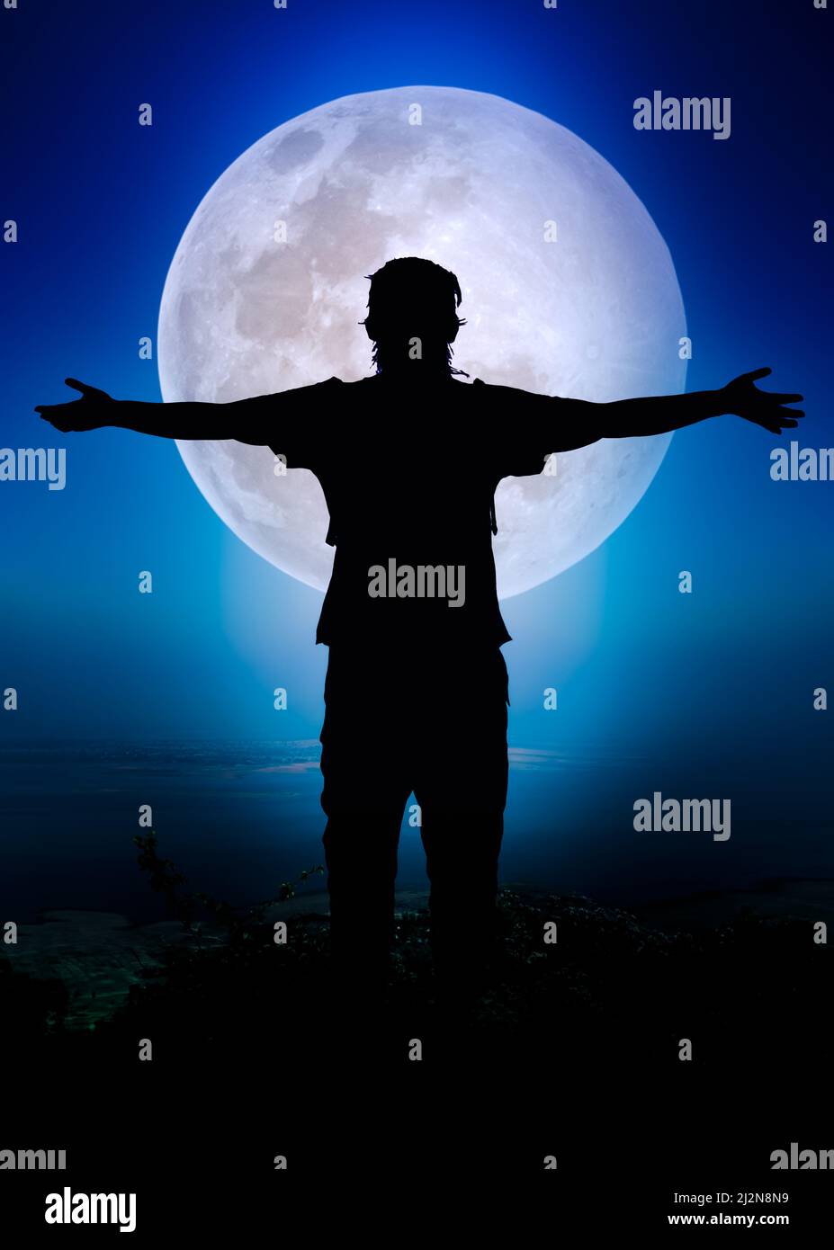 Back view of happy woman relaxing and stretch the arms with large moon ...