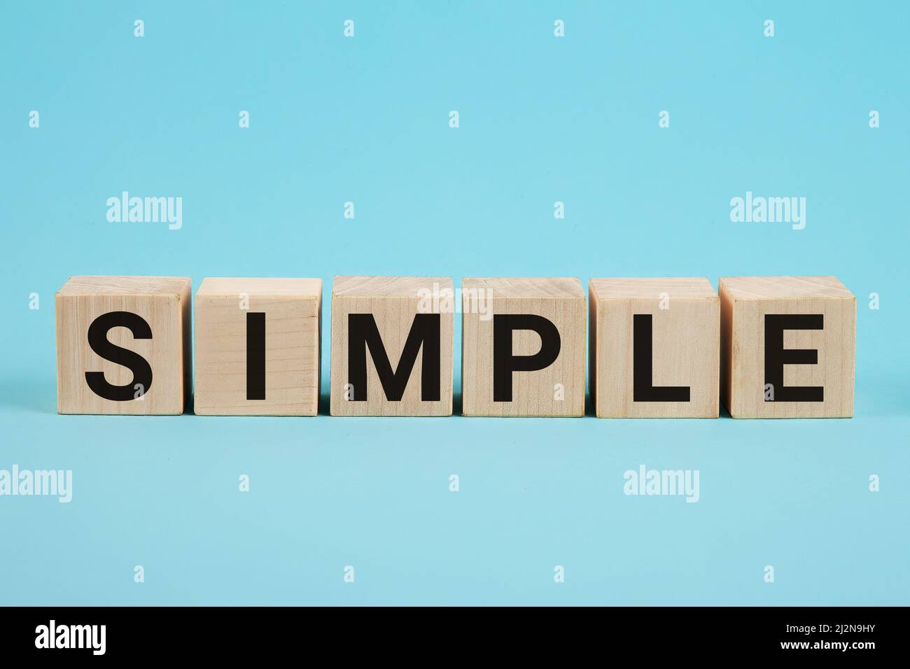 SIMPLE word from wooden blocks with letters, to make something easy ...