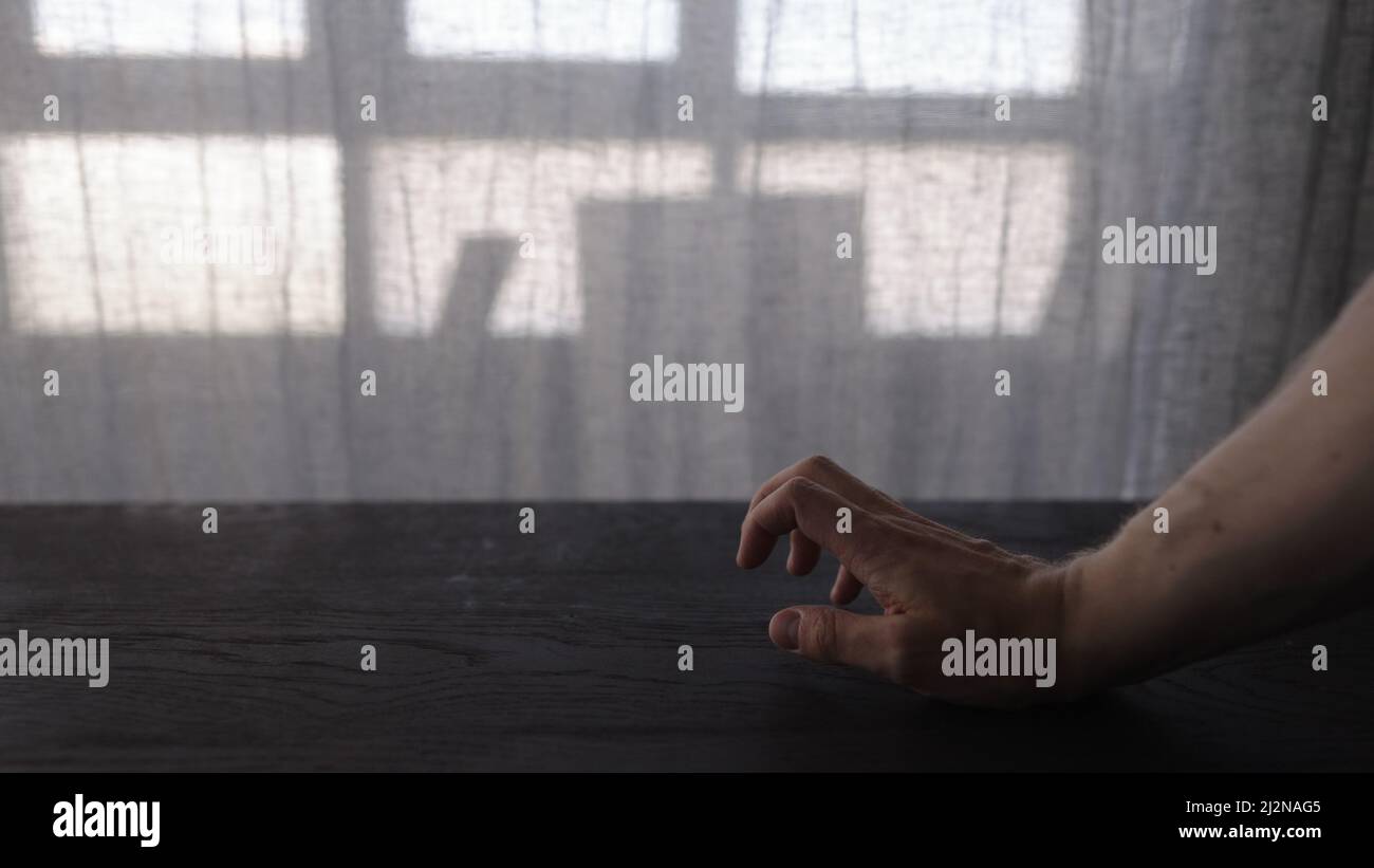 man hand finger tapping on black oak table with copy space, wide photo ...