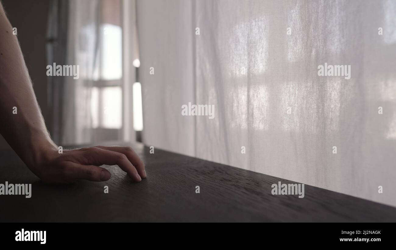 man hand finger tapping on black oak table with copy space, wide photo ...