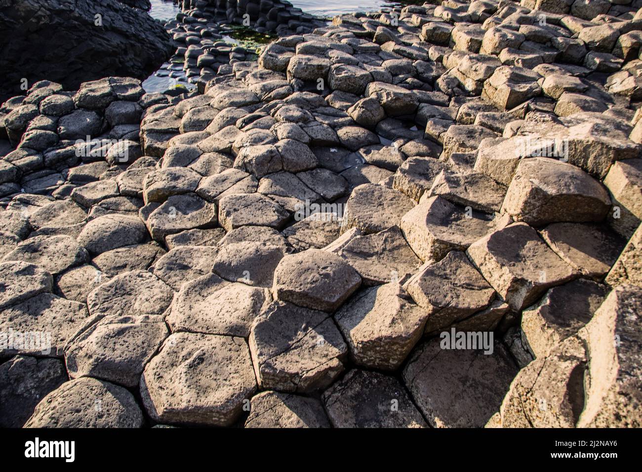 Sunset over basalt columns Giant's Causeway, County Antrim, Northern ...