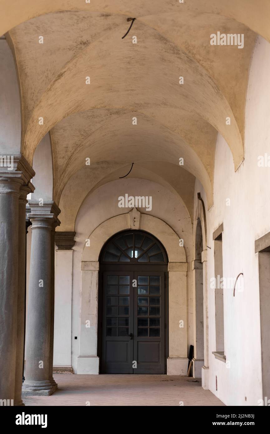 an arch with columns in an old historical building of European ...