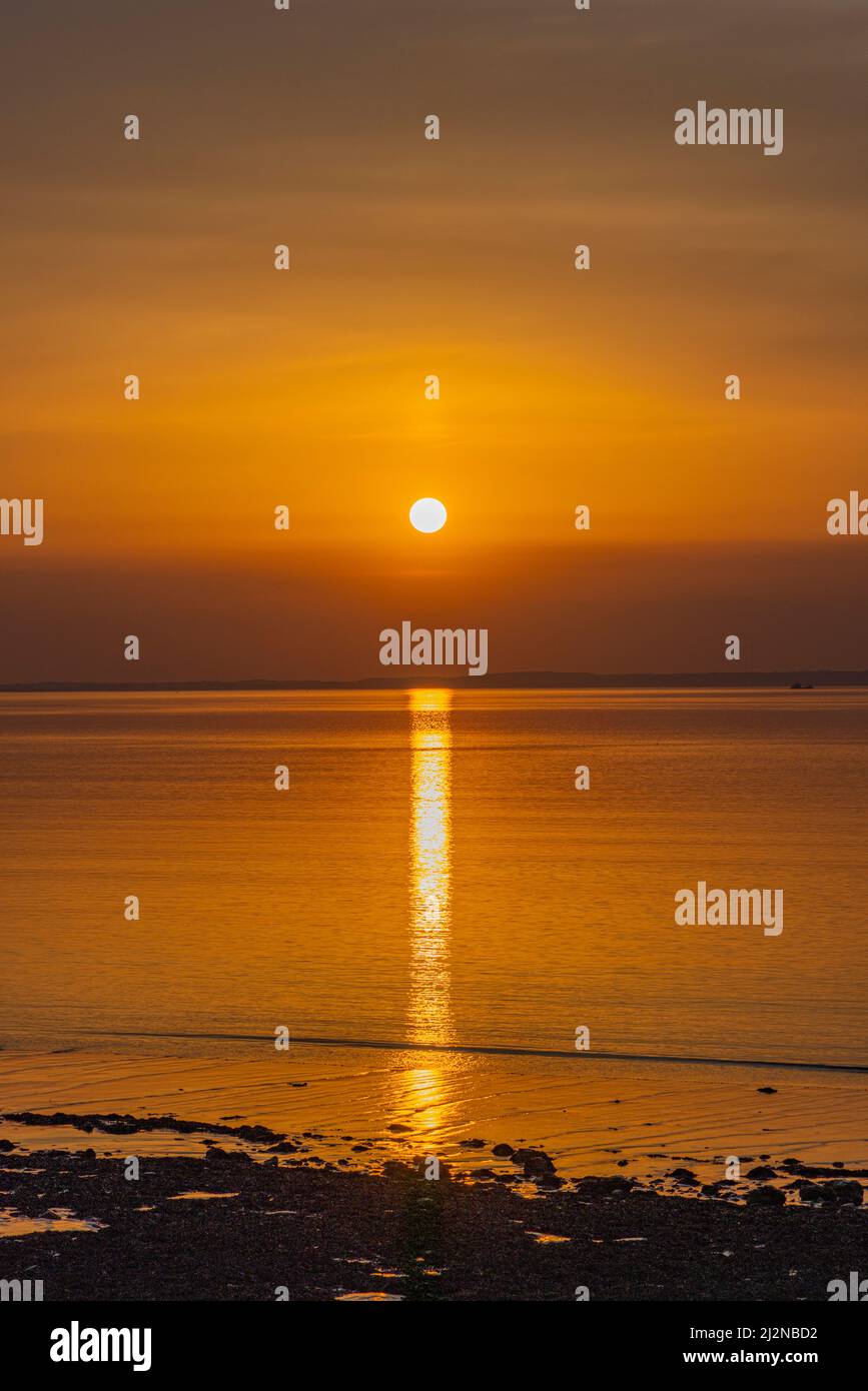 Sunset over the Bristol channel with a streak of sunlight Stock Photo ...