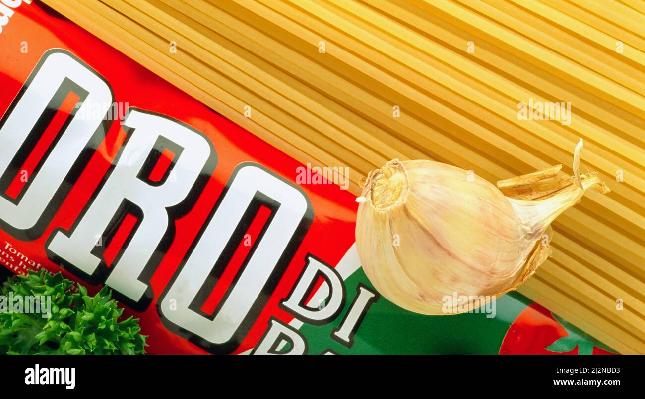 Close-up of spaghetti, tube of tomato paste and clove of garlic Stock ...