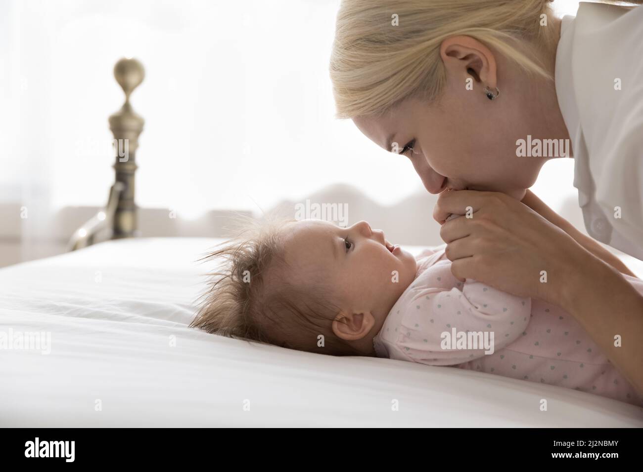 Baby lying on parent hi-res stock photography and images - Alamy