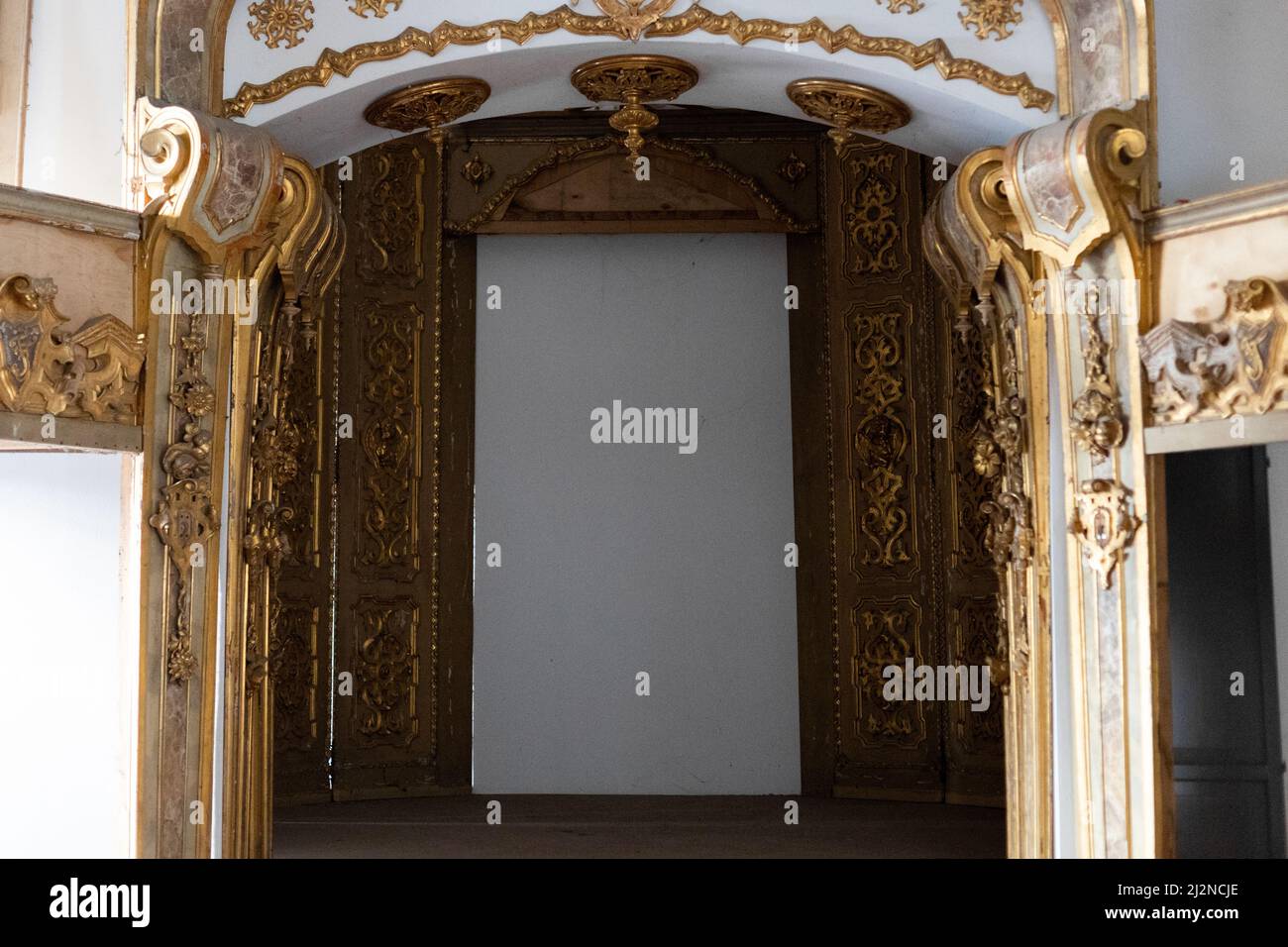 a old gothic gold frame wall decor in old architecture Stock Photo - Alamy
