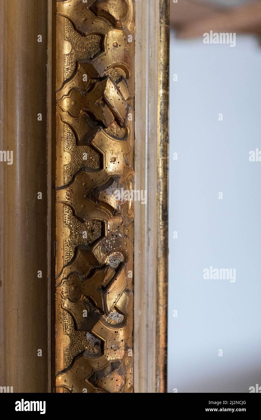 a old gothic gold frame wall decor in old architecture Stock Photo - Alamy