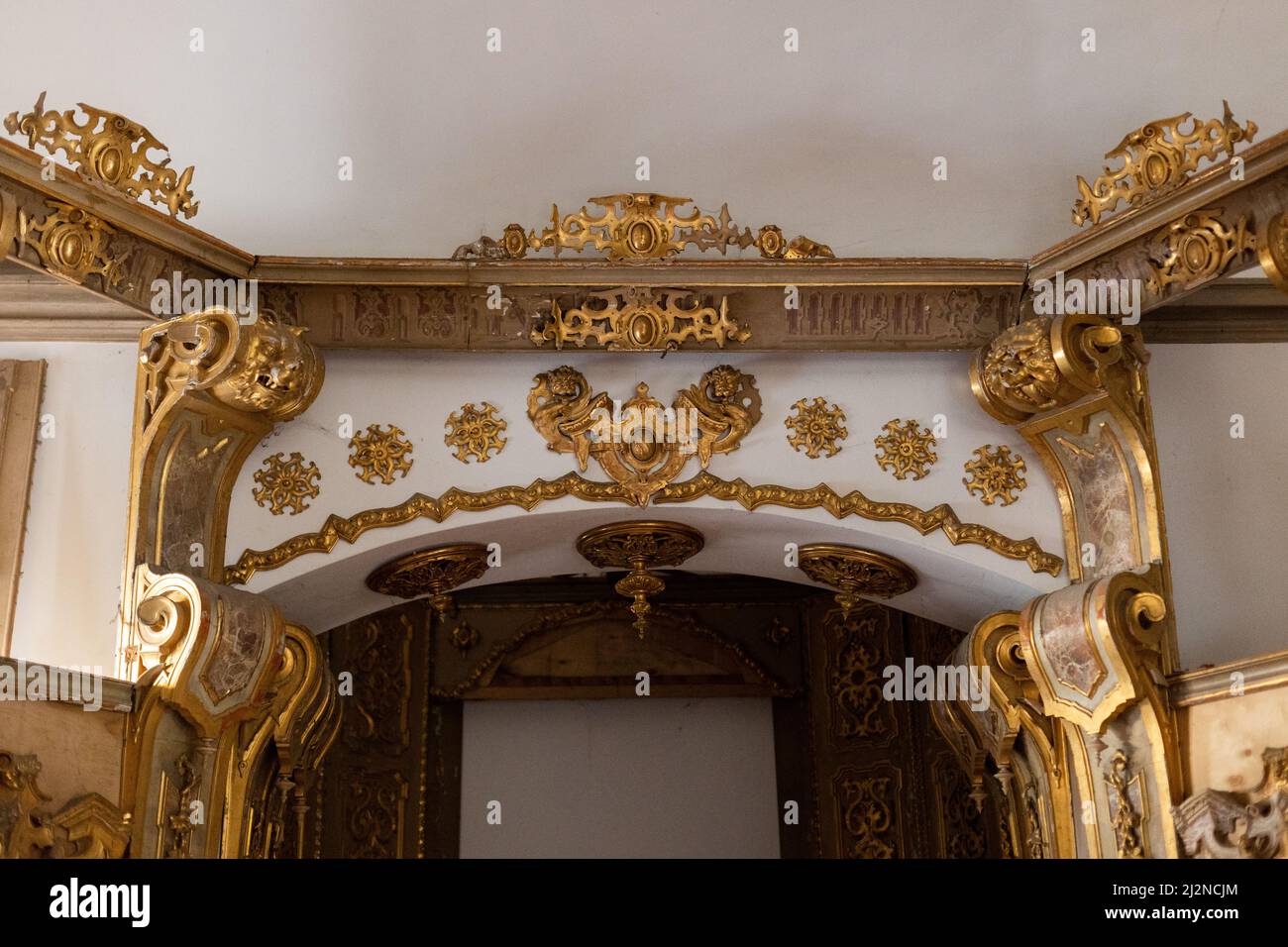 a old gothic gold frame wall decor in old architecture Stock Photo - Alamy