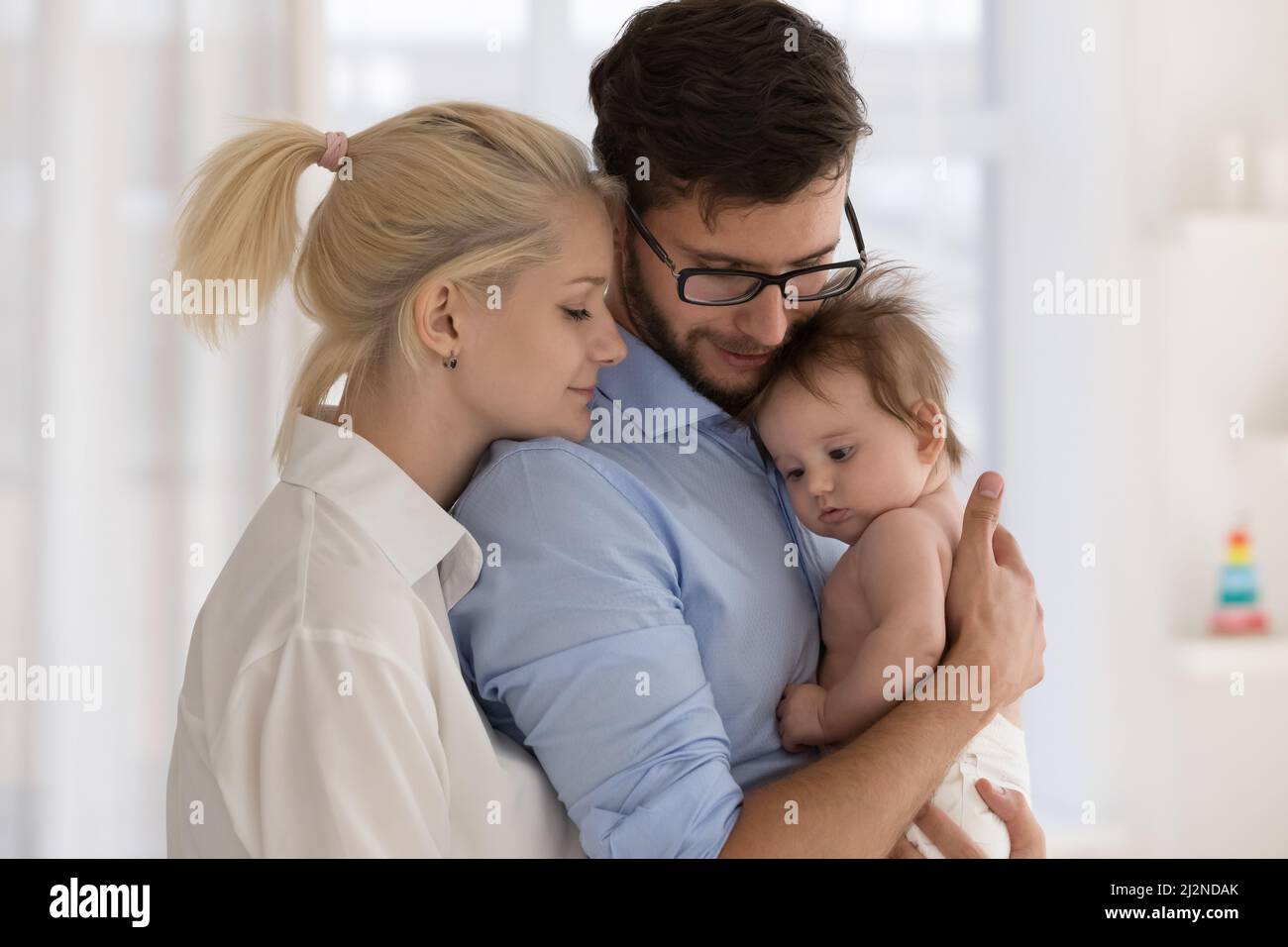 Peaceful young married couple enjoying being family, parents Stock ...