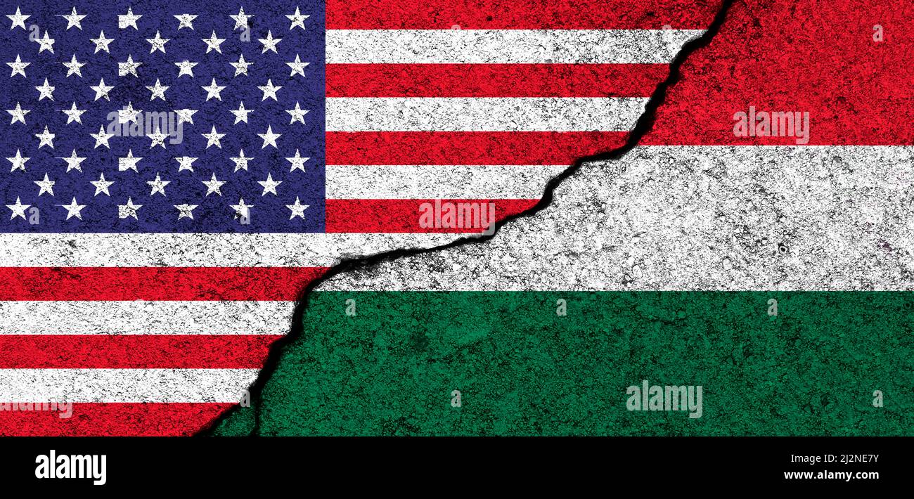 USA and Hungary. Flags painted on cracked concrete wall. United States ...
