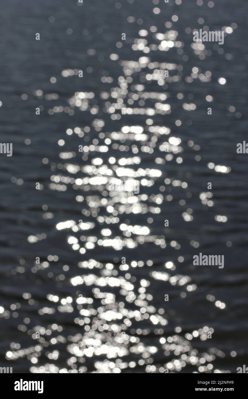 The sunlight reflecting off the surface of lake water Stock Photo - Alamy