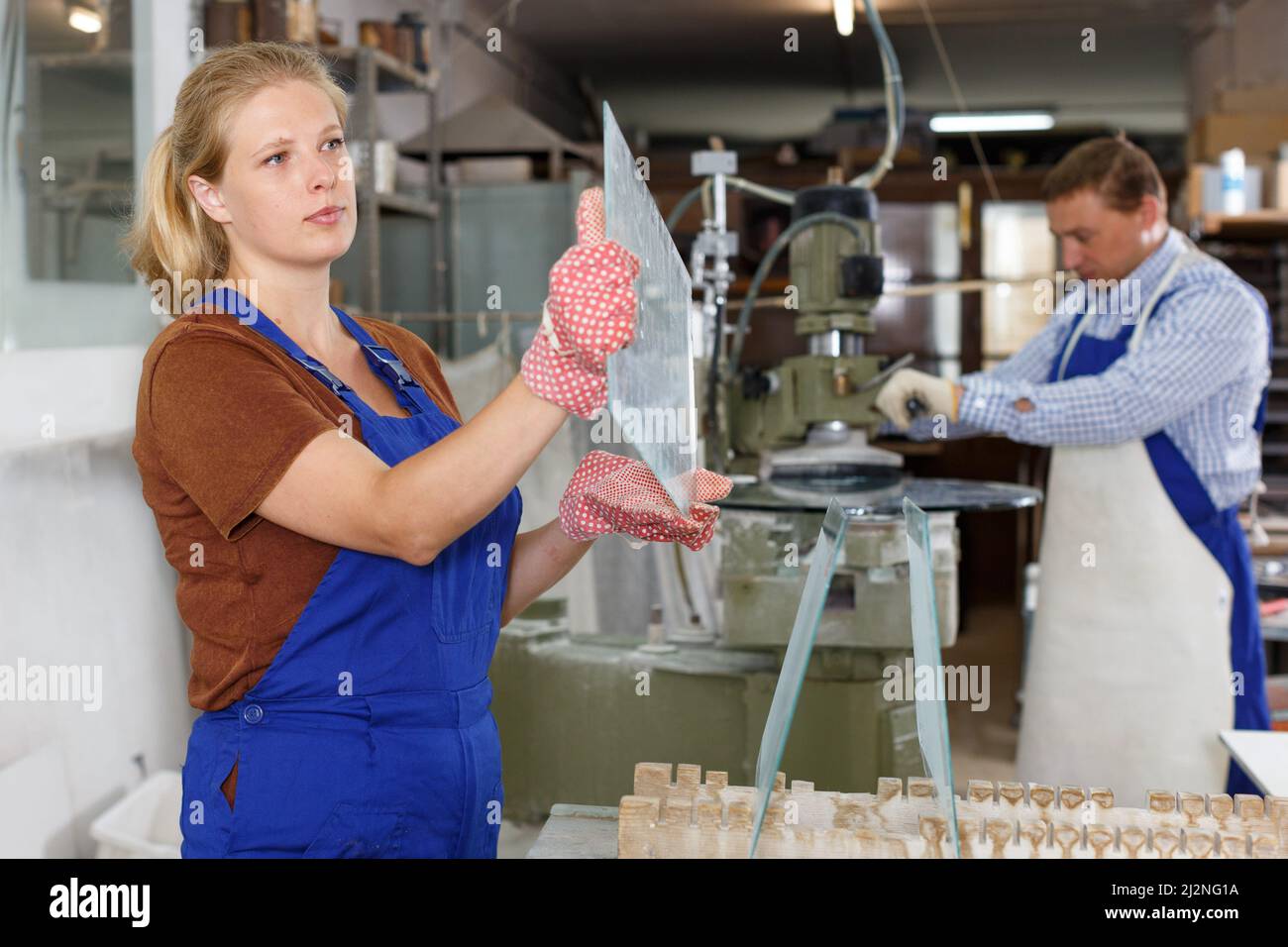 Female glazier working in glass factory Stock Photo - Alamy