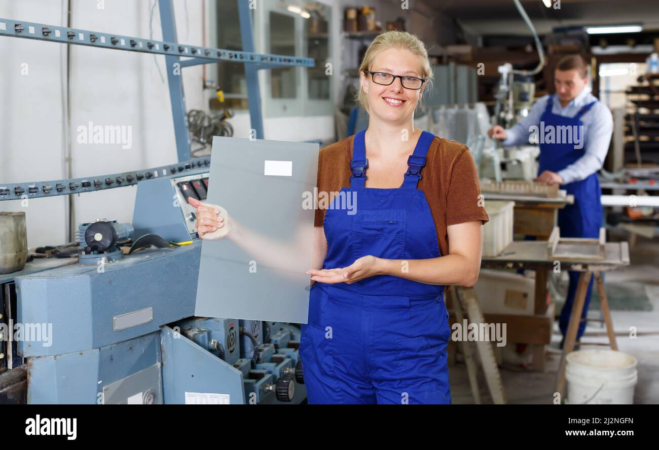 Happy young woman installing hi-res stock photography and images - Alamy