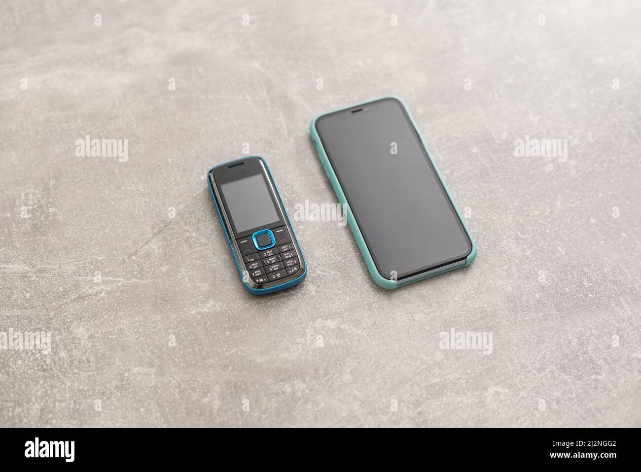 Second generation digital technology. smart phone and old technology ...