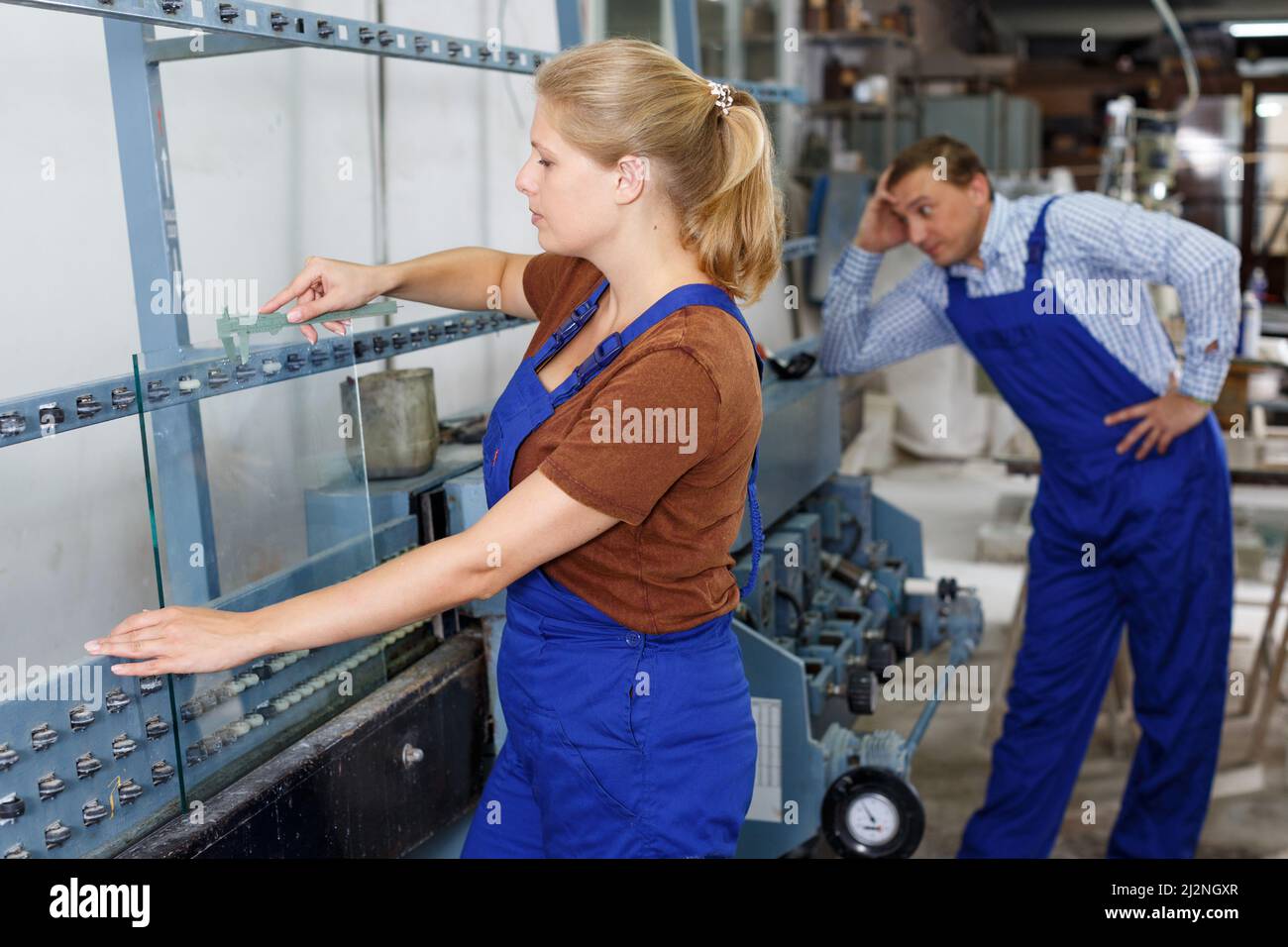 Female glazier measuring glass with caliper Stock Photo - Alamy