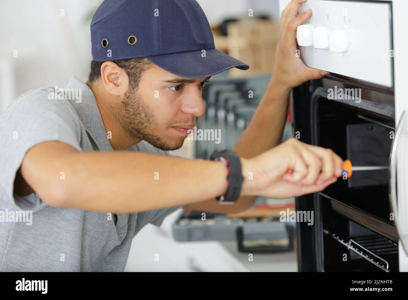 expert panel fixing the kitchen Stock Photo - Alamy