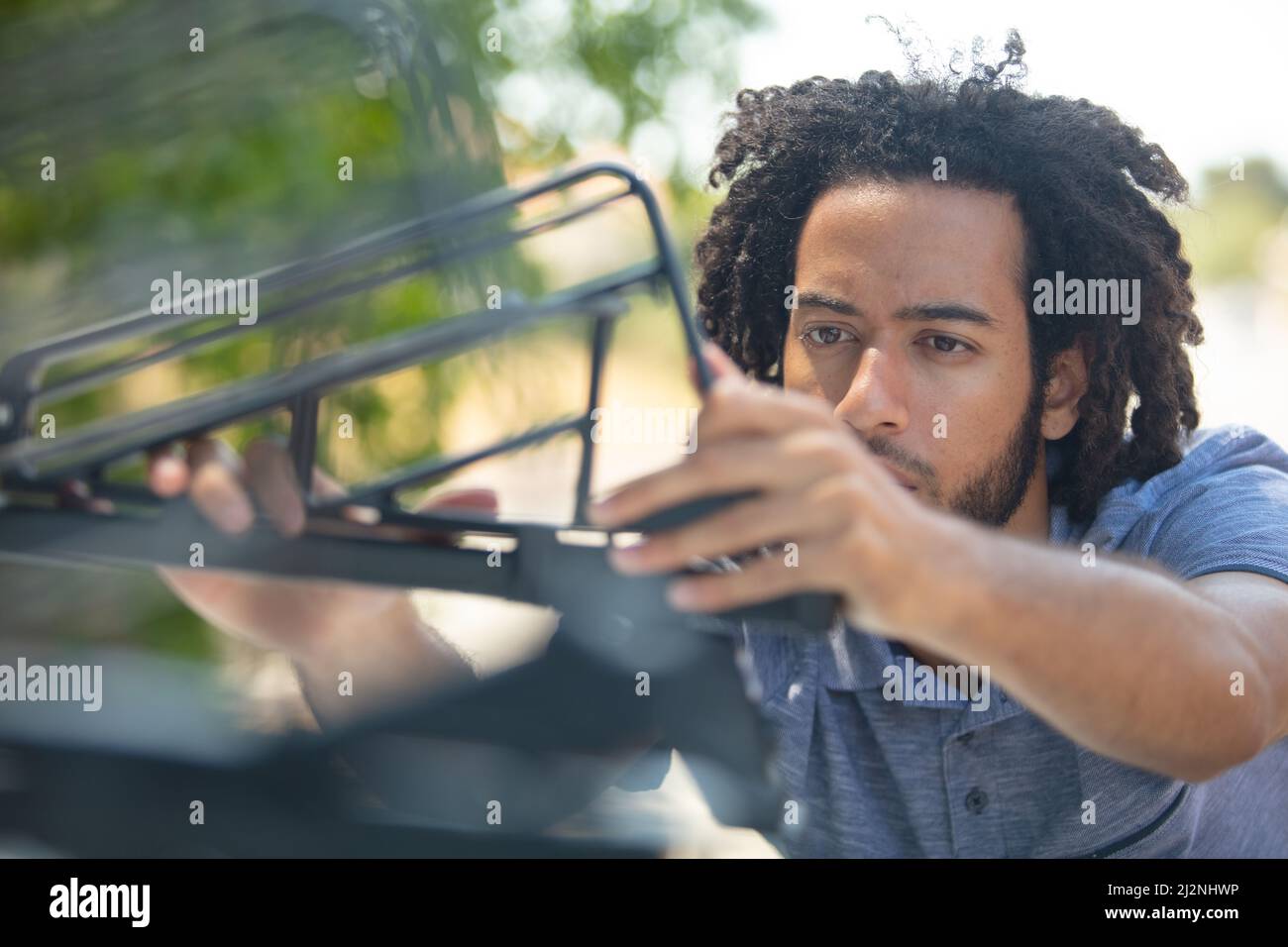 Man fixing rack roof hi-res stock photography and images - Alamy