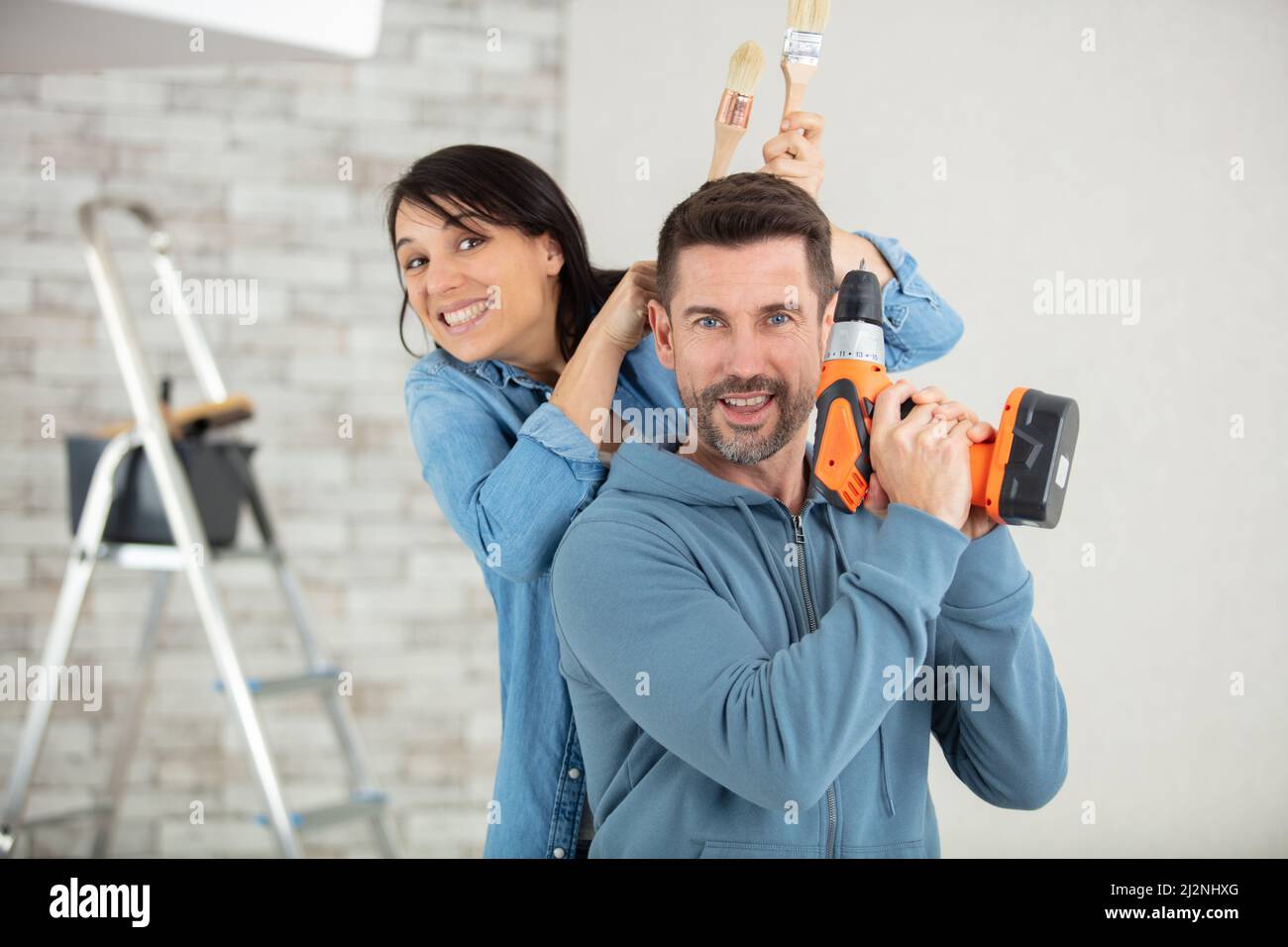 Couple renovating hi-res stock photography and images - Alamy