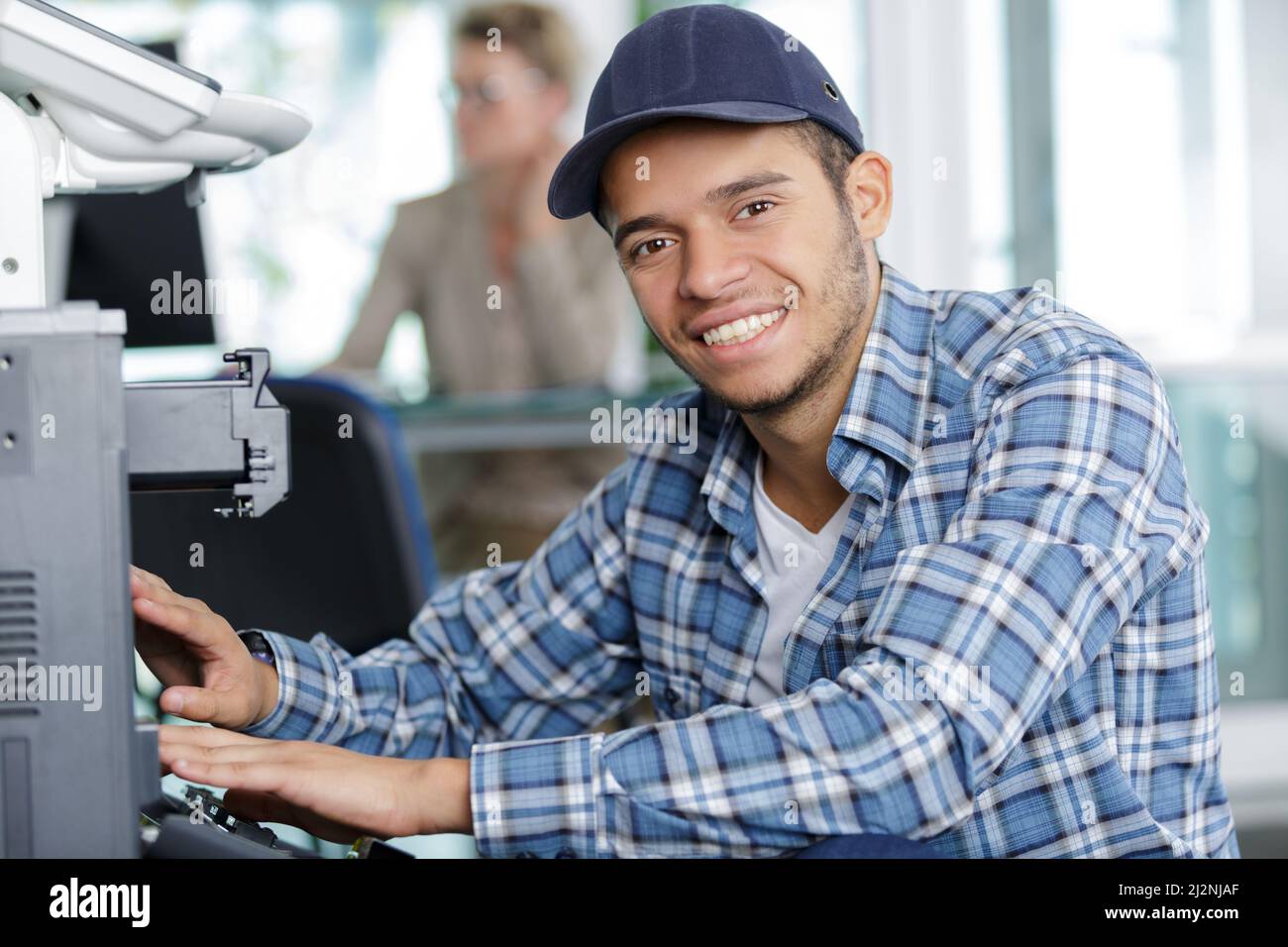 hardware repairman repairing broken printer fax machine Stock Photo - Alamy