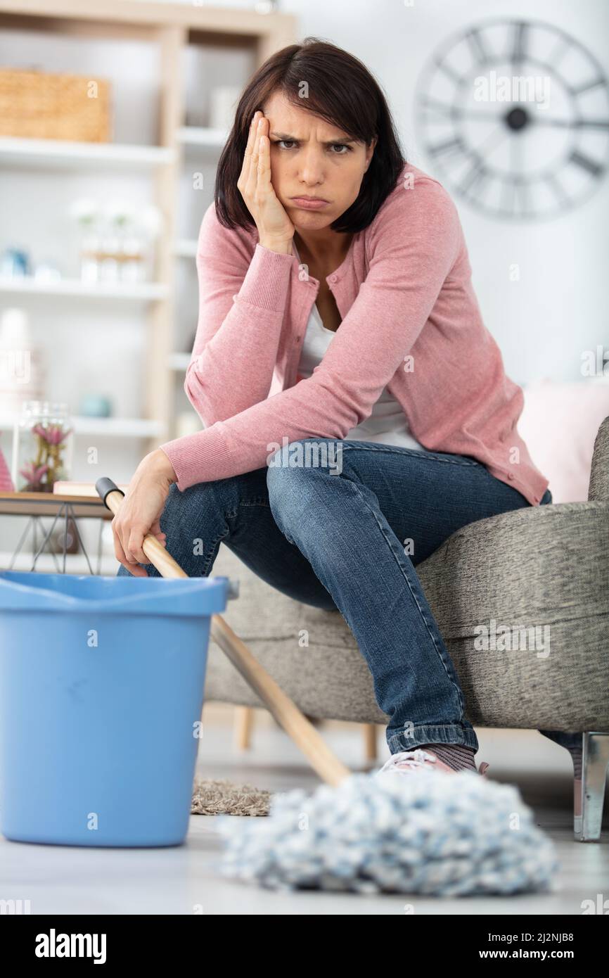 Sad woman holding brush hi-res stock photography and images - Alamy