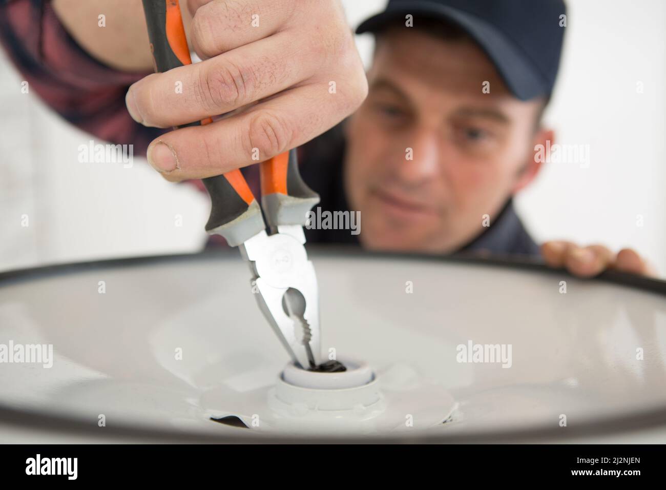 male worker with clamps Stock Photo - Alamy