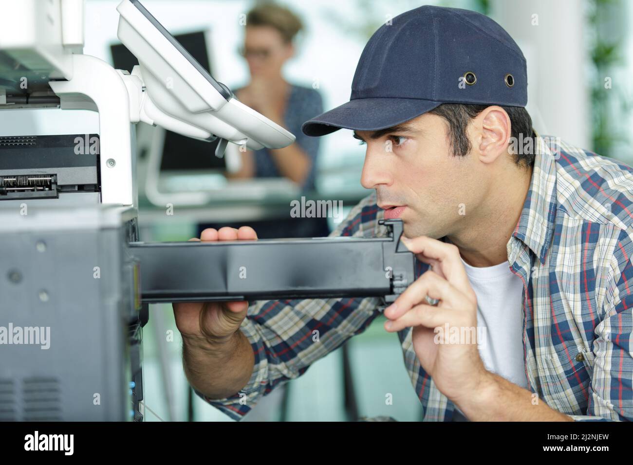 middle age man fixing a printer Stock Photo - Alamy