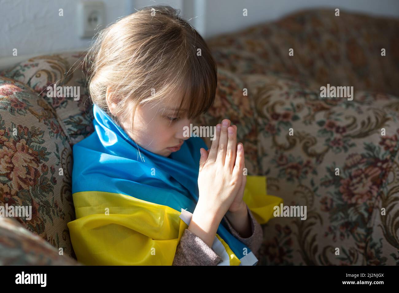 Pray for Ukraine. Child with Ukrainian flag. Little girl waving ...