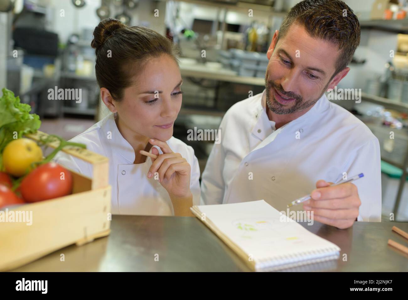 Male female chef explaining hi-res stock photography and images - Alamy