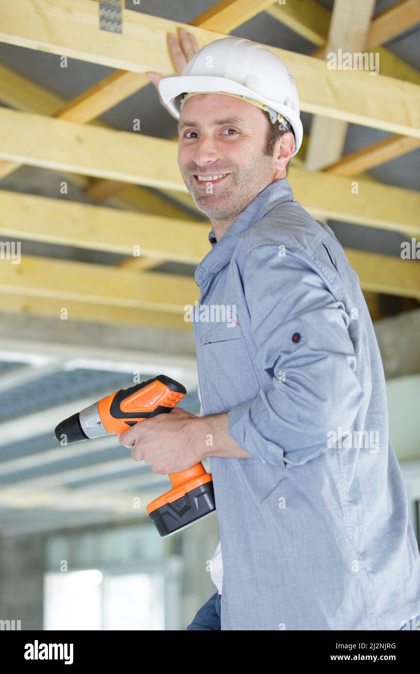 Handyman drilling ceiling hi-res stock photography and images - Alamy