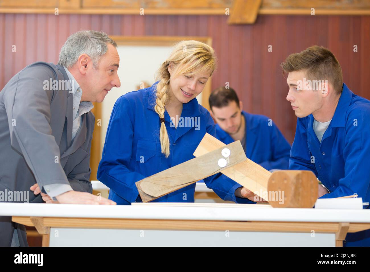 Apprentice trainee construction on building hi-res stock photography ...