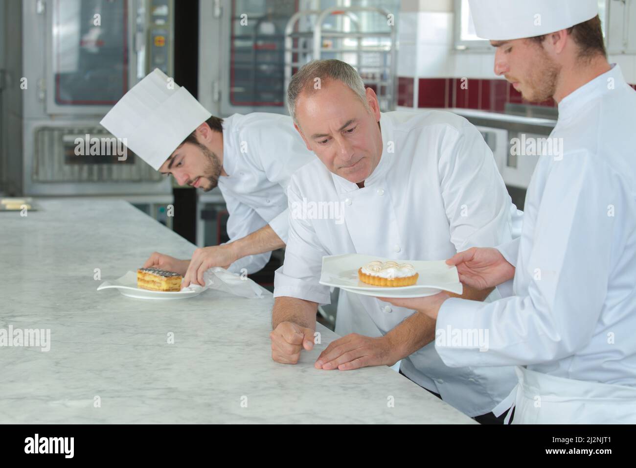 Chief pastry chef cooking cream hi-res stock photography and images - Alamy