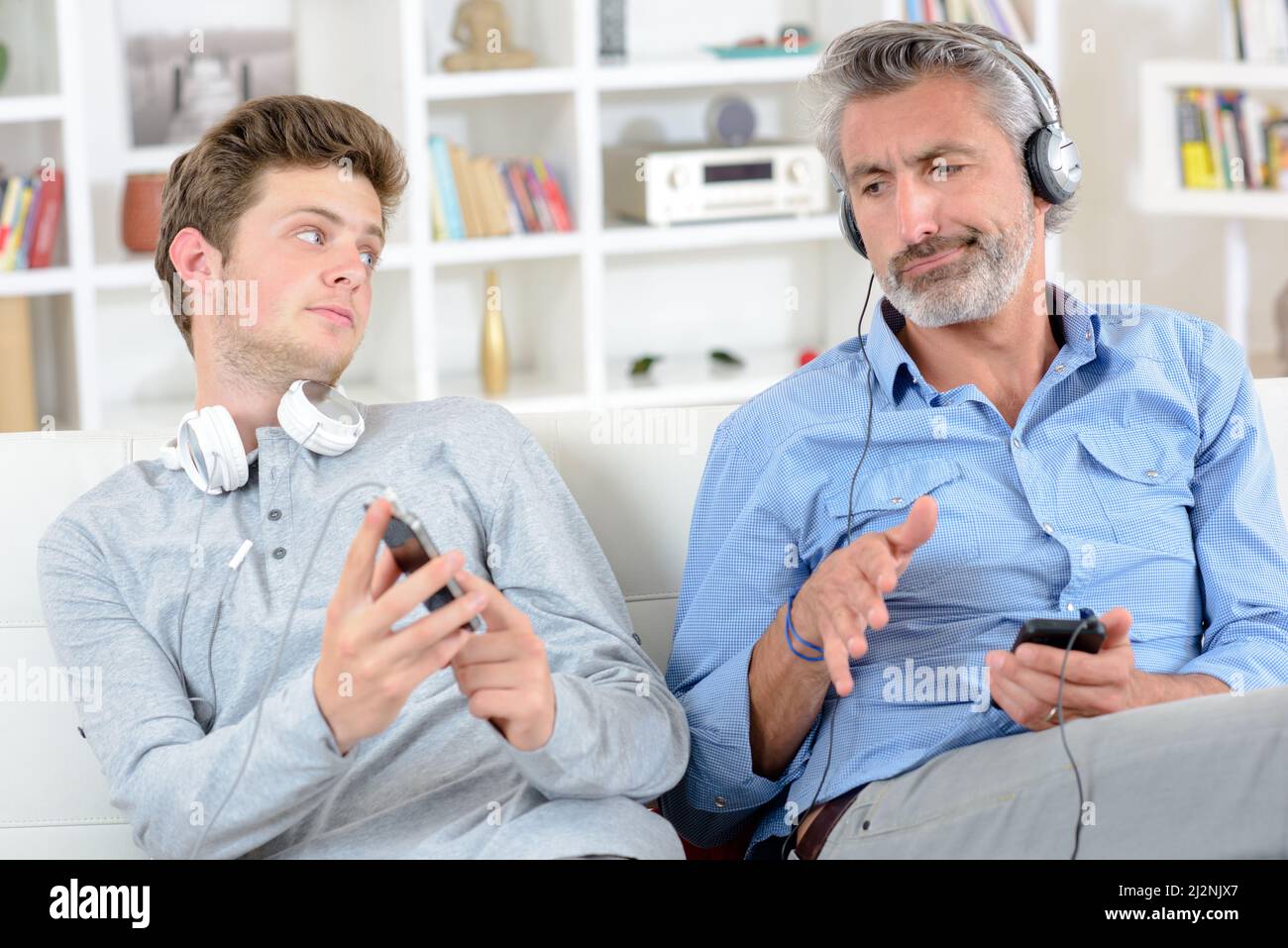 Teen father son talking sofa hi-res stock photography and images - Alamy