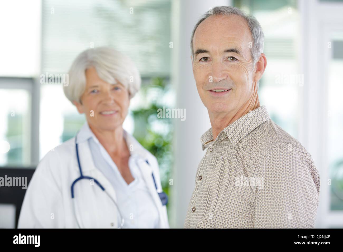 doctor visiting disabled senior patient at home Stock Photo - Alamy