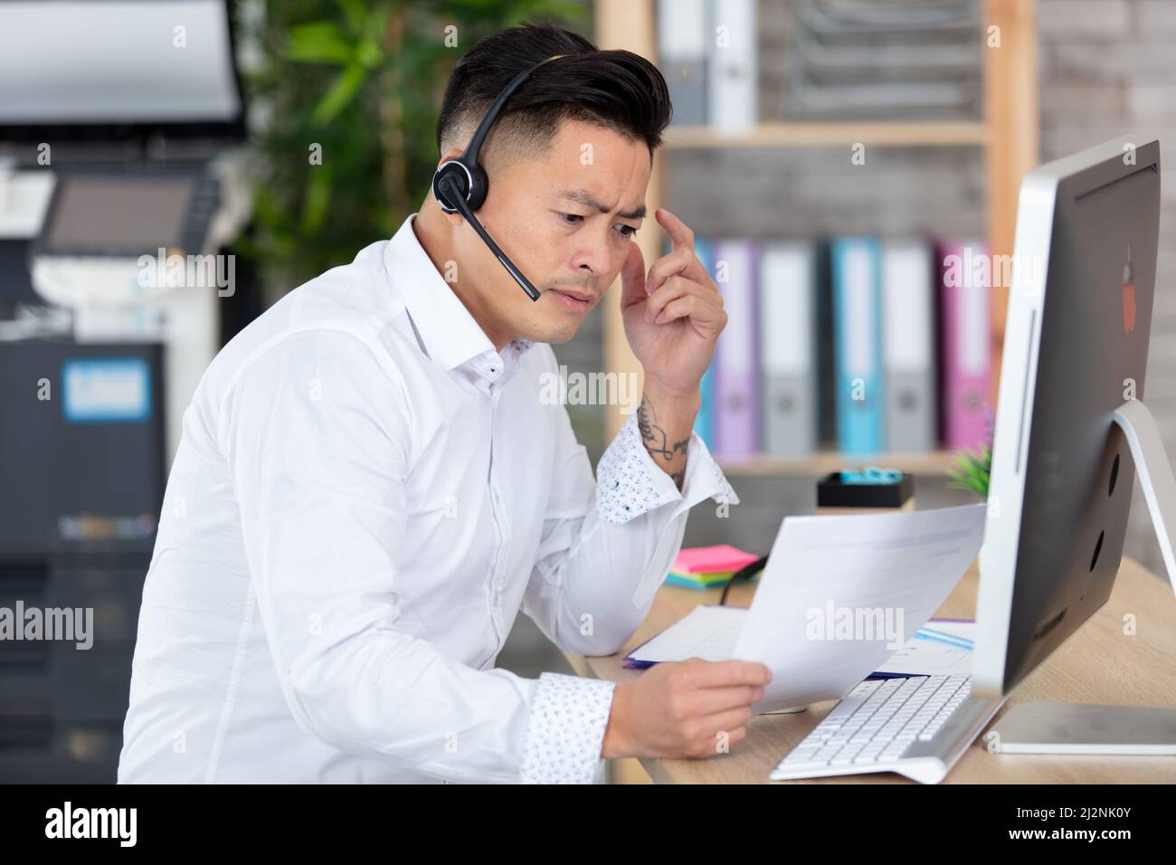 asian man at the office with computer Stock Photo - Alamy