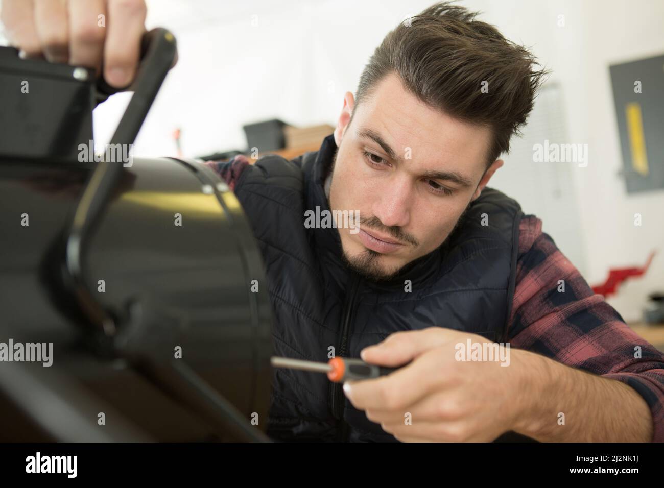 man is fixing mechanical parts Stock Photo - Alamy