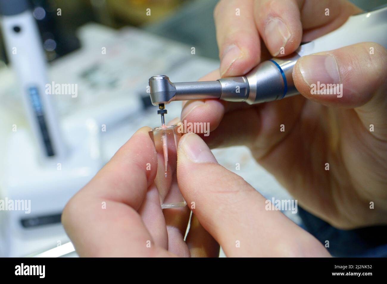 Doctor hands showing how root canal filling injector is working Stock ...