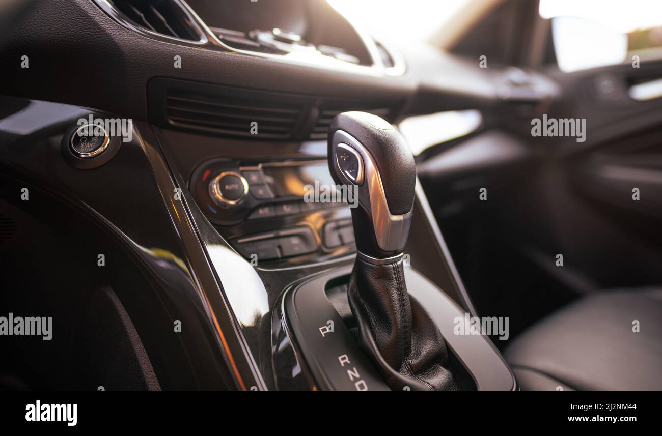 Automatic gear stick of a modern car. Car interior details Stock Photo ...