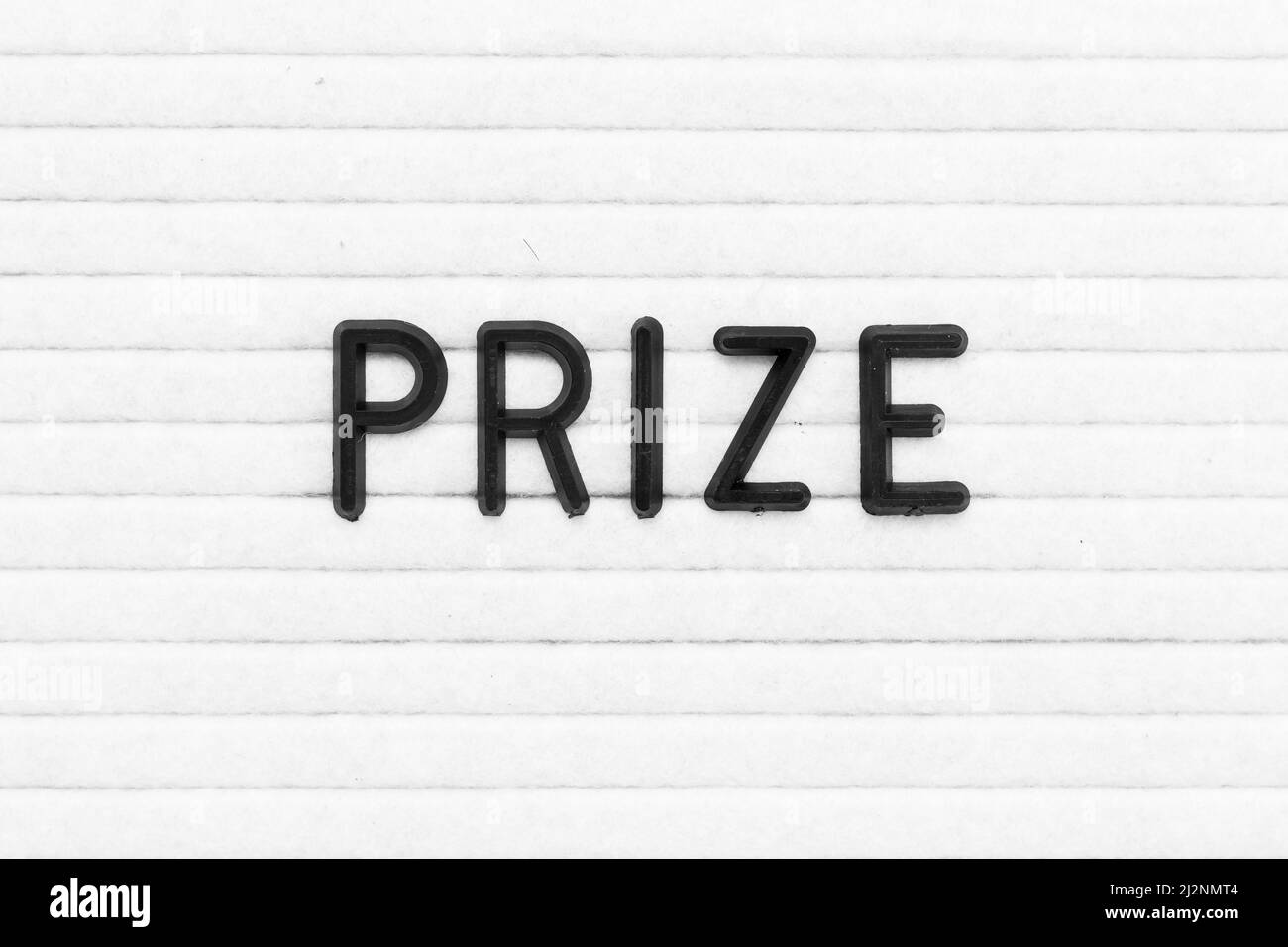 Black color letter in word prize on white felt board background Stock ...