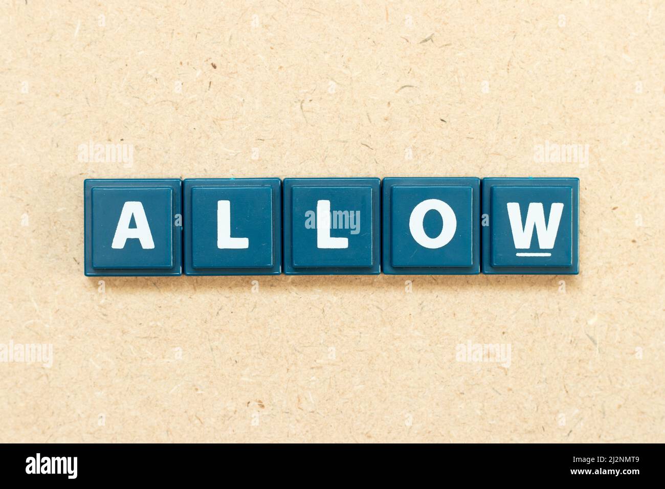Tile alphabet letter in word allow on wood background Stock Photo - Alamy