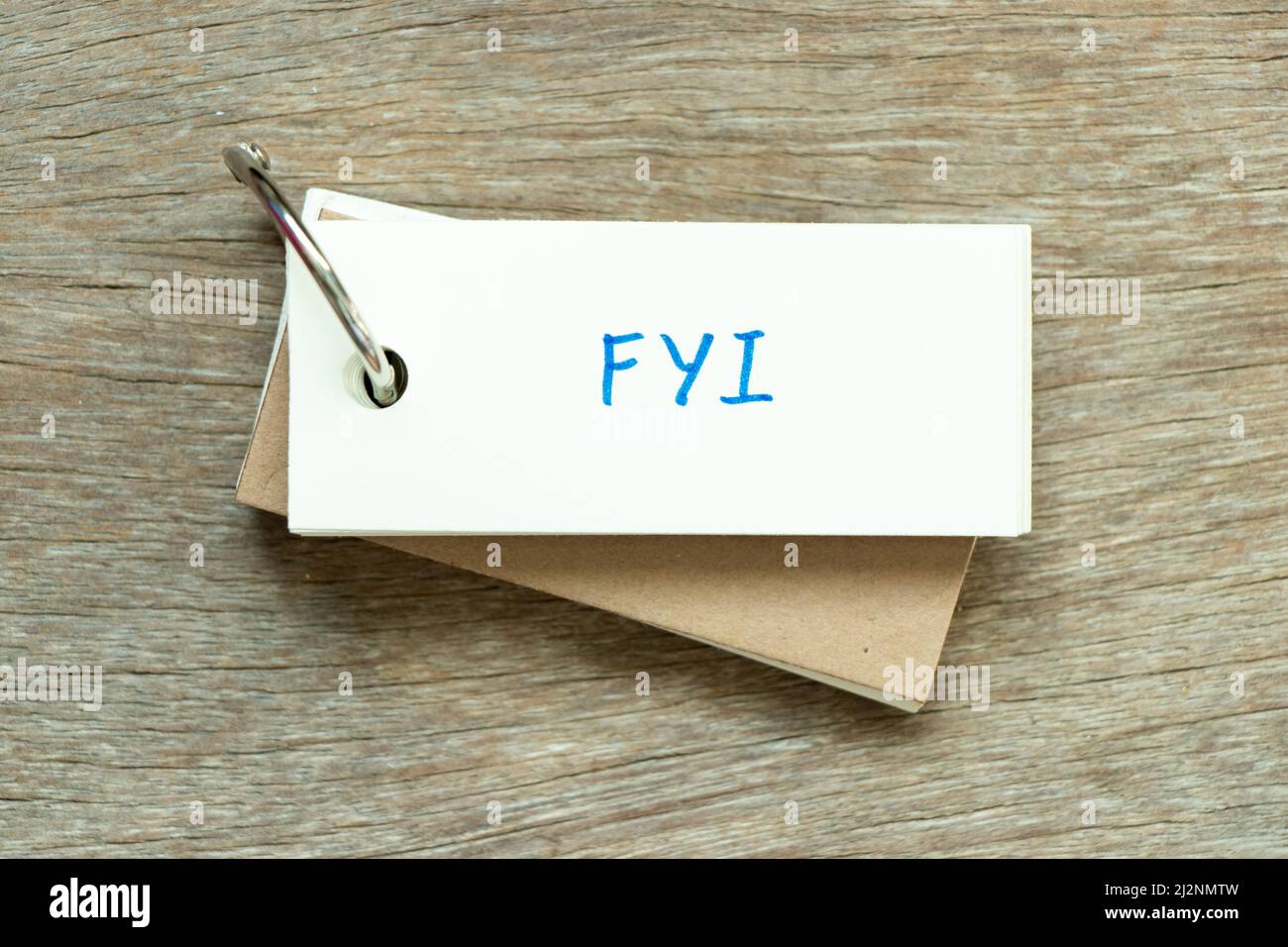 Flash card with handwriting word FYI (Abbreviation of For your ...