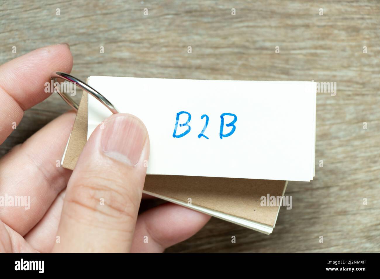 Man hold the flash card with handwriting word b2b (abbreviation of ...