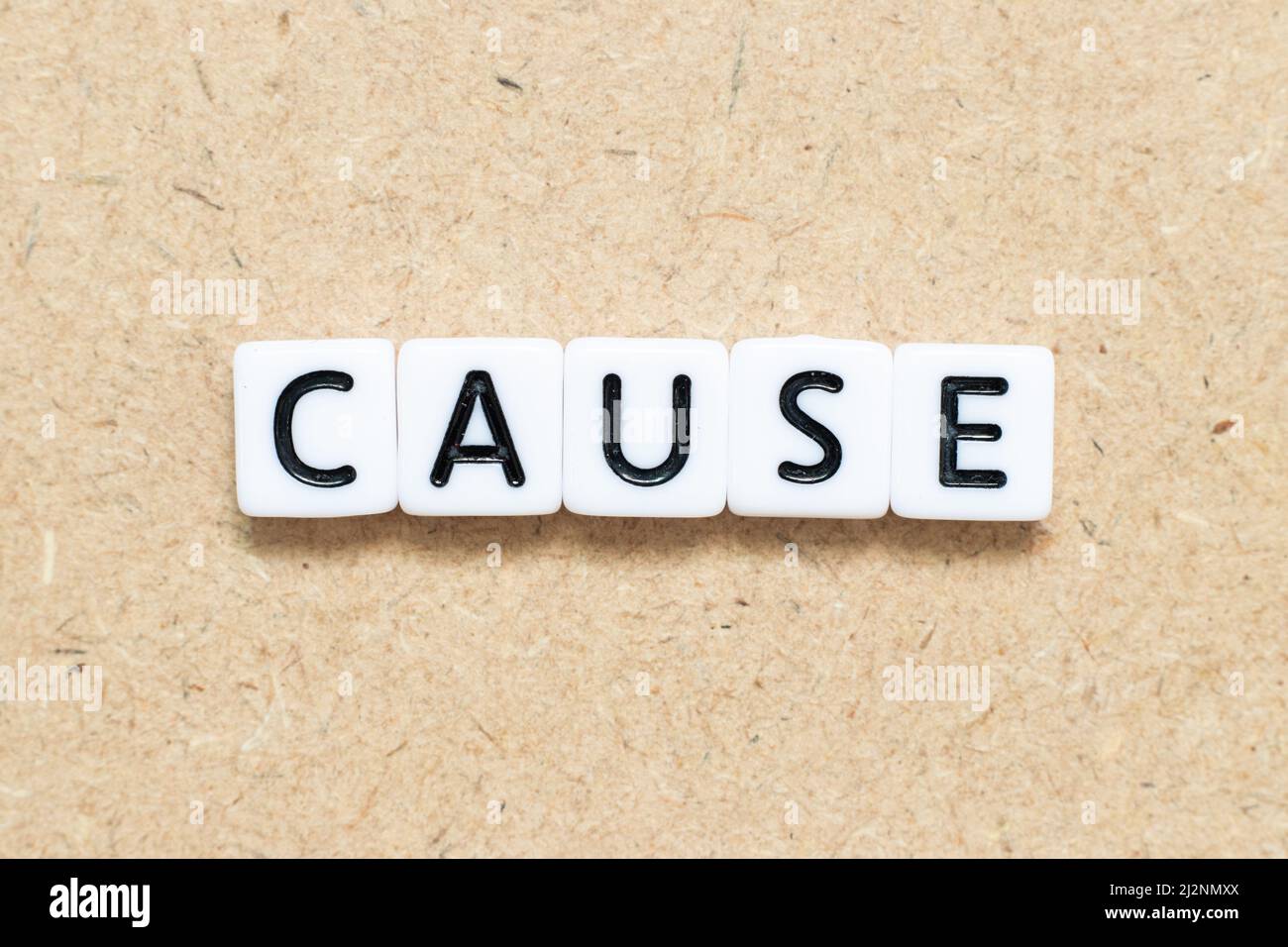 White tile alphabet letter with word cause on wood background Stock ...