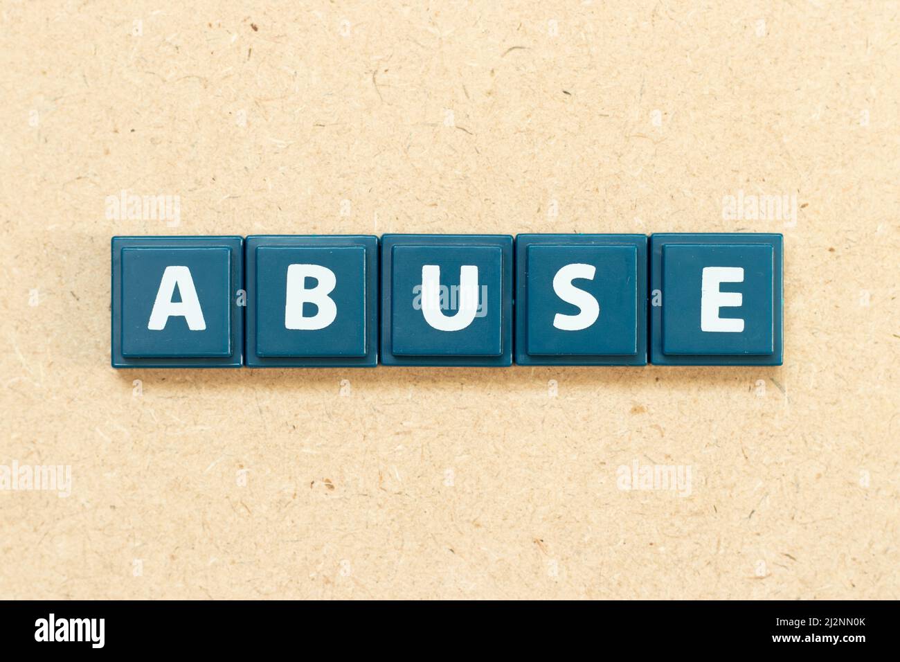 Tile alphabet letter in word abuse on wood background Stock Photo - Alamy