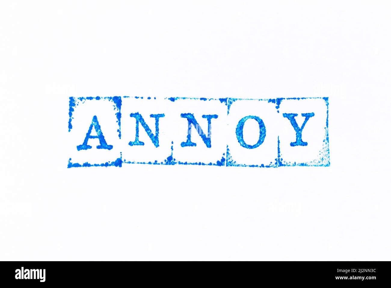 Blue color ink rubber stamp in word annoy on white paper background ...
