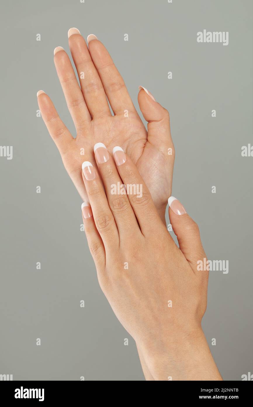 Beautiful woman's hands with perfect nails after manicure salon with ...