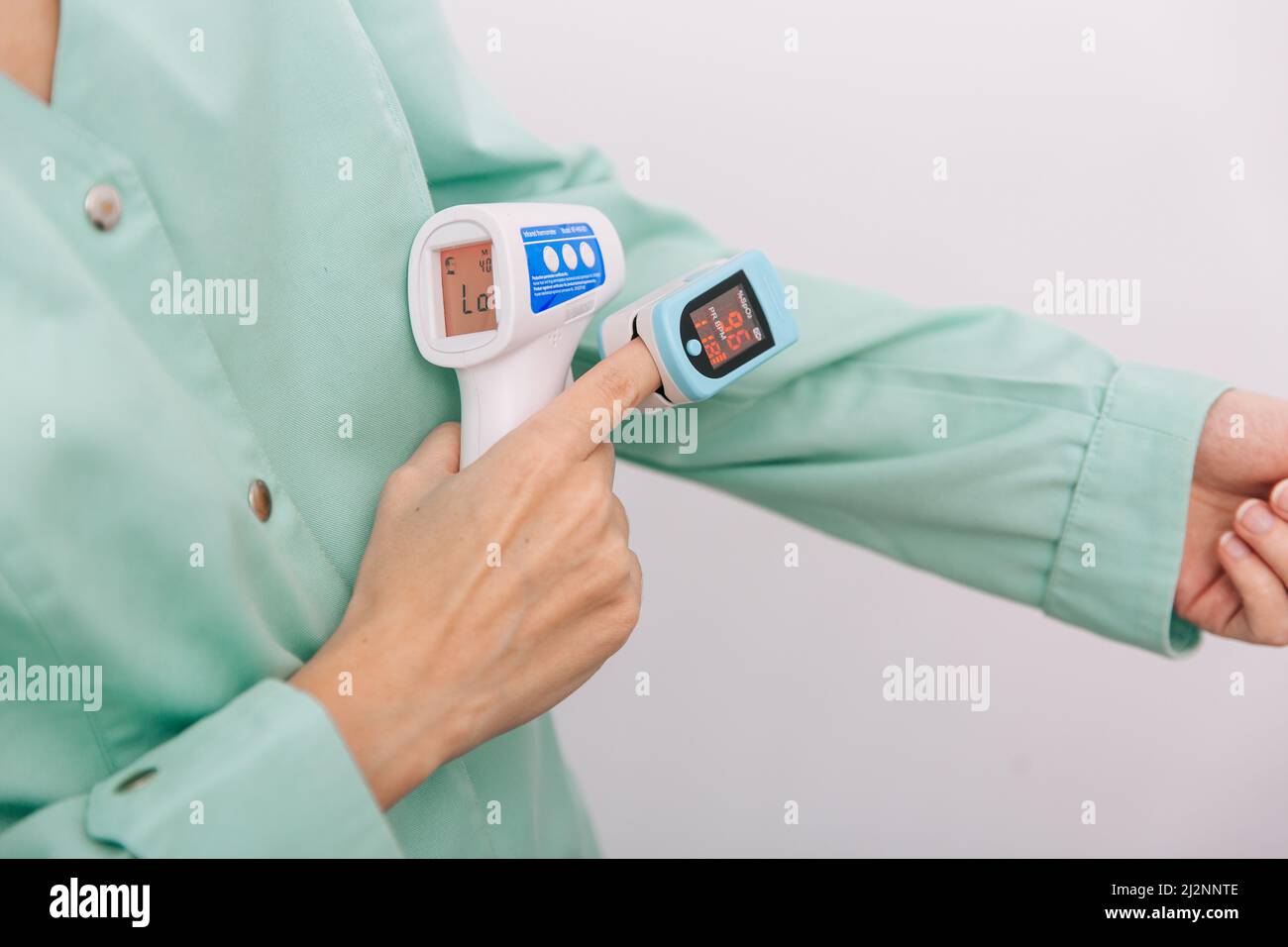 Temperature measurement gun in doctor hands. Close-up shot of doctor ...