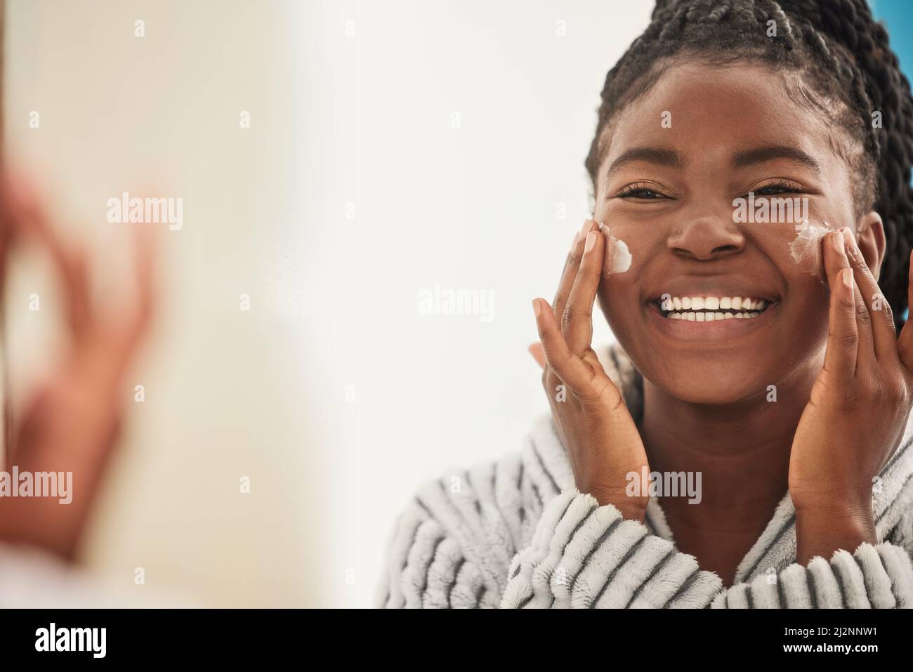 My secret is a good face cream. Cropped shot of a beautiful young woman ...