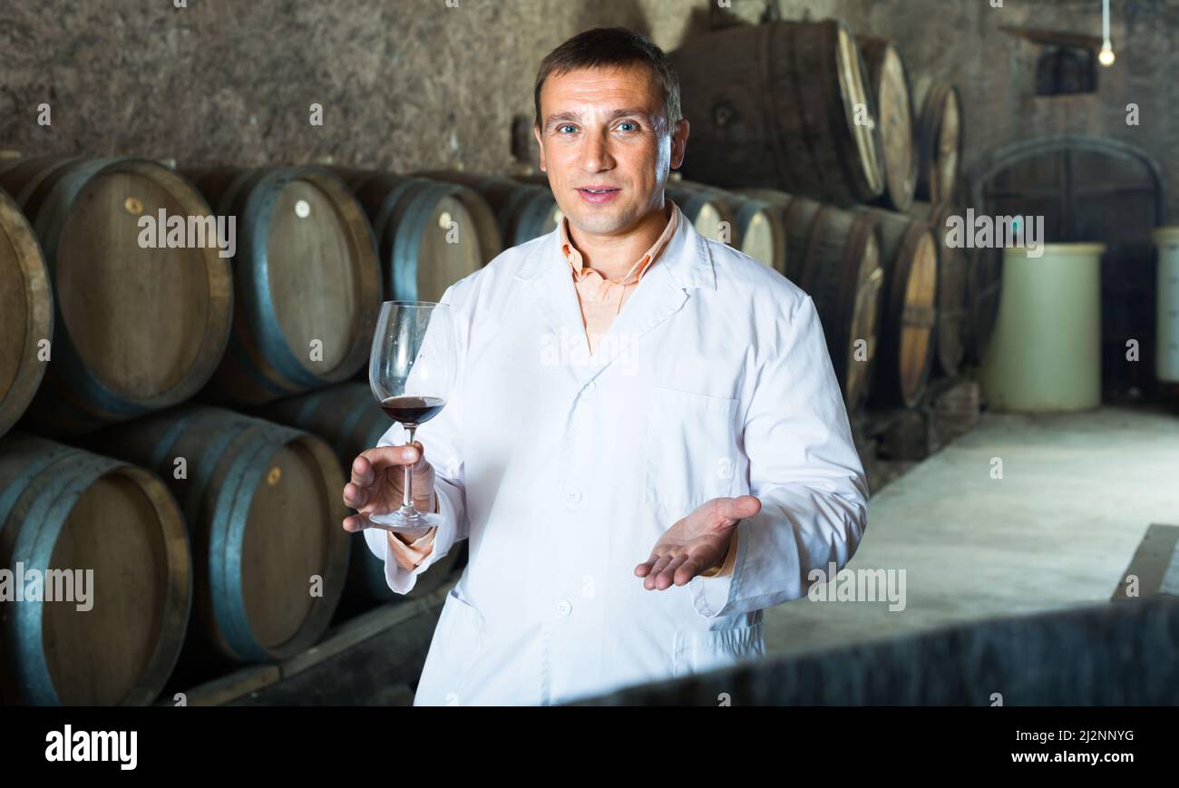 Professional male sommelier checking hi-res stock photography and ...
