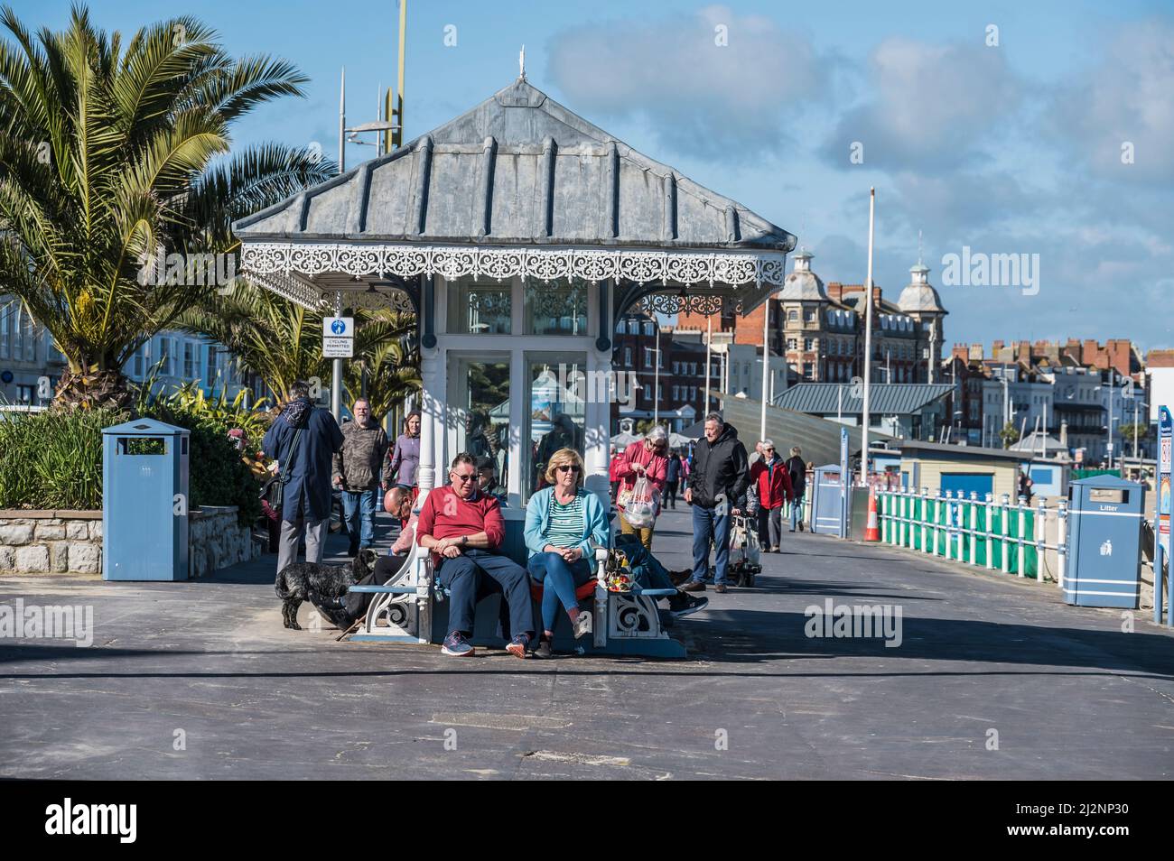 Colourful scenes of holiday-makers relaxing on Weymouth's Esplanade ...