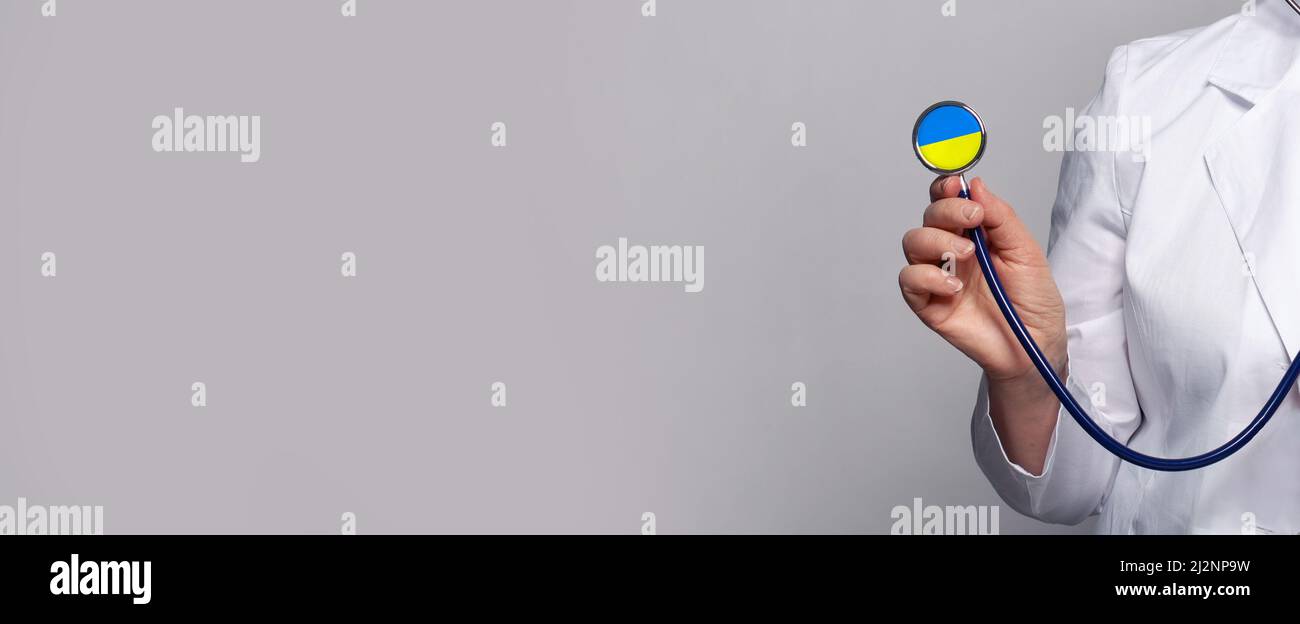 Female doctor with stethoscope with color of the Ukraine flag. Concept ...